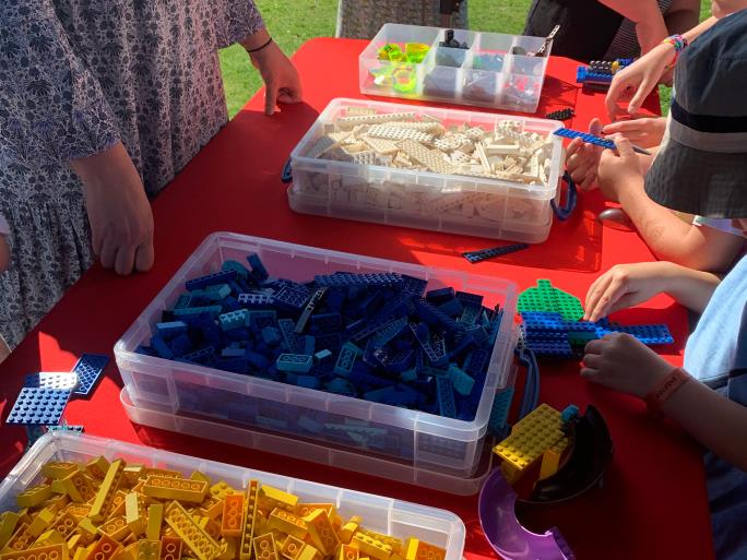 Photo of table with boxes of Lego bricks